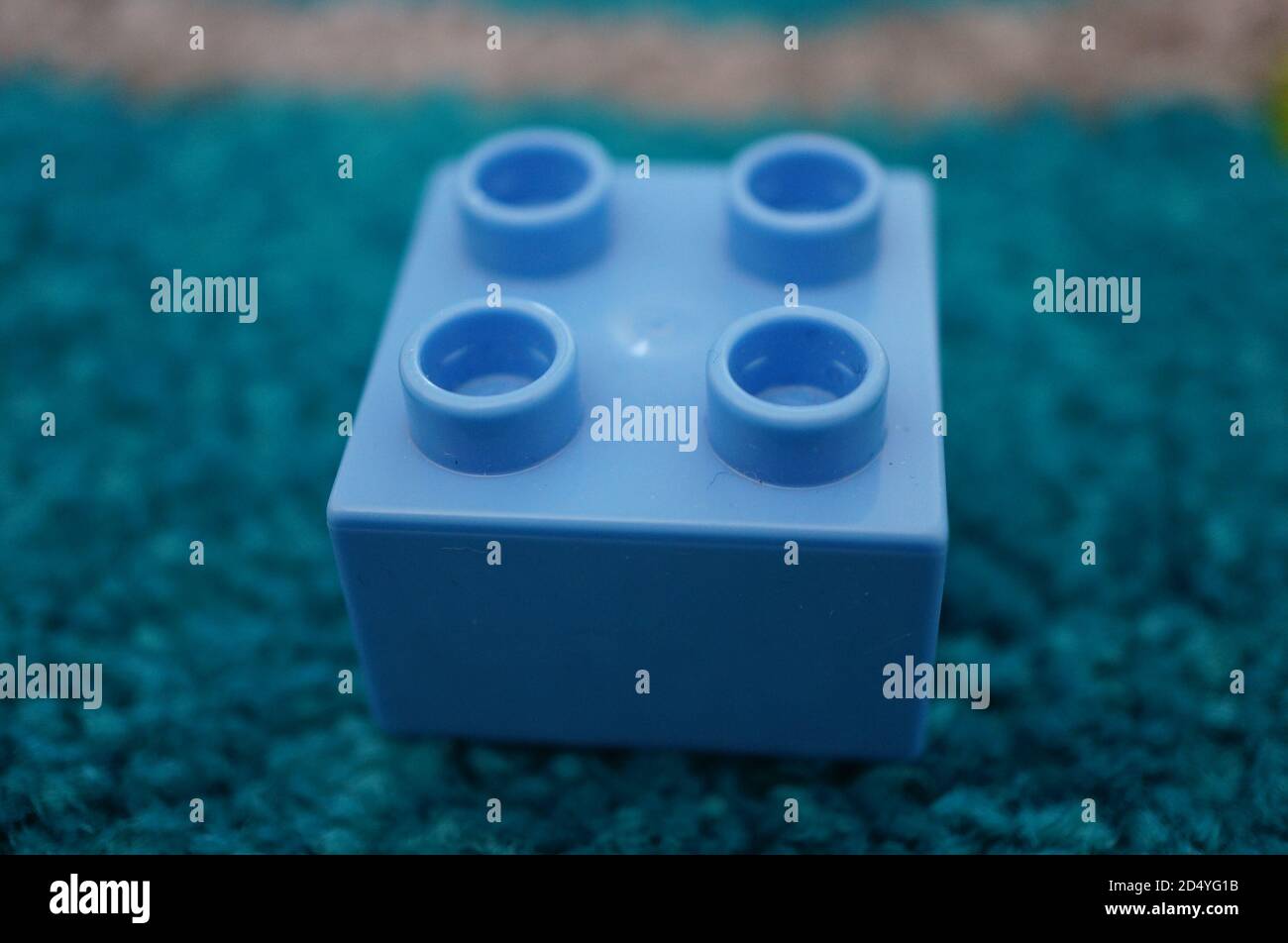 POZNAN, POLAND - Oct 10, 2020: Blue Lego Duplo toy build block on soft ...