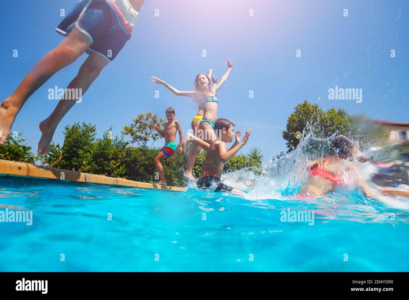 Team jumping in water hi-res stock photography and images - Alamy