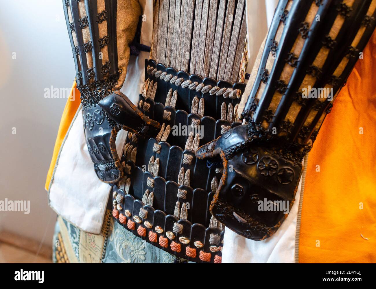 Original medieval japanese samurai armor (yoroi) in the museum. Hands ...