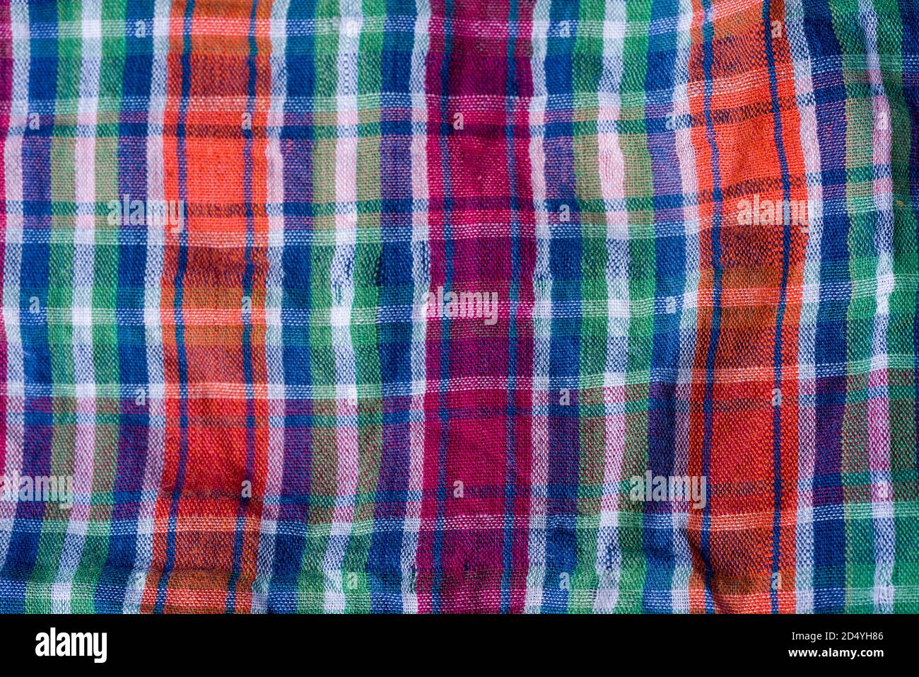 Folded crumpled multicolored checkered cotton fabric background texture ...