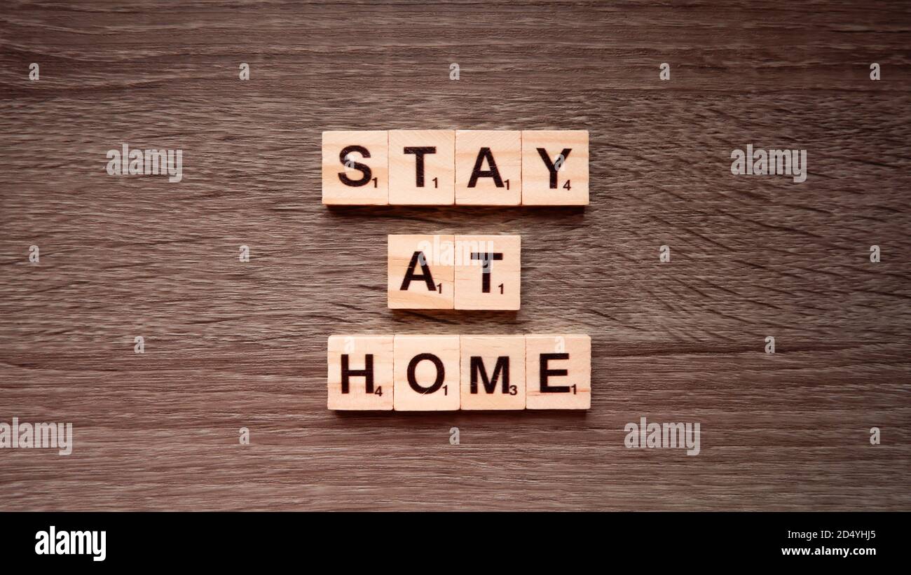 STAY HOME word text background Stock Photo - Alamy