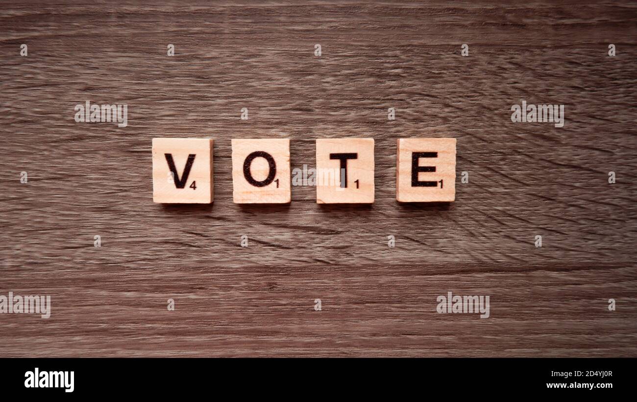 VOTE word text on face mask background Stock Photo - Alamy