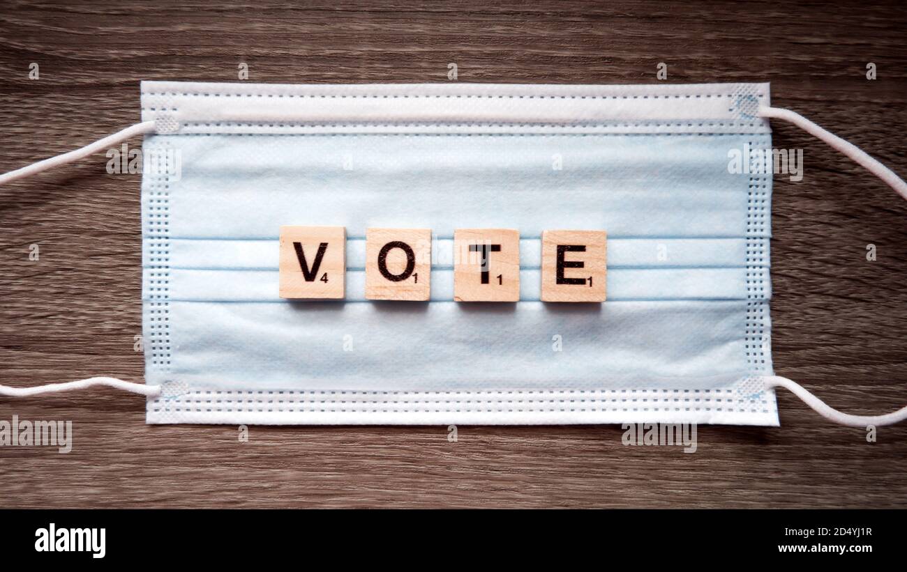 VOTE word text on face mask background Stock Photo - Alamy