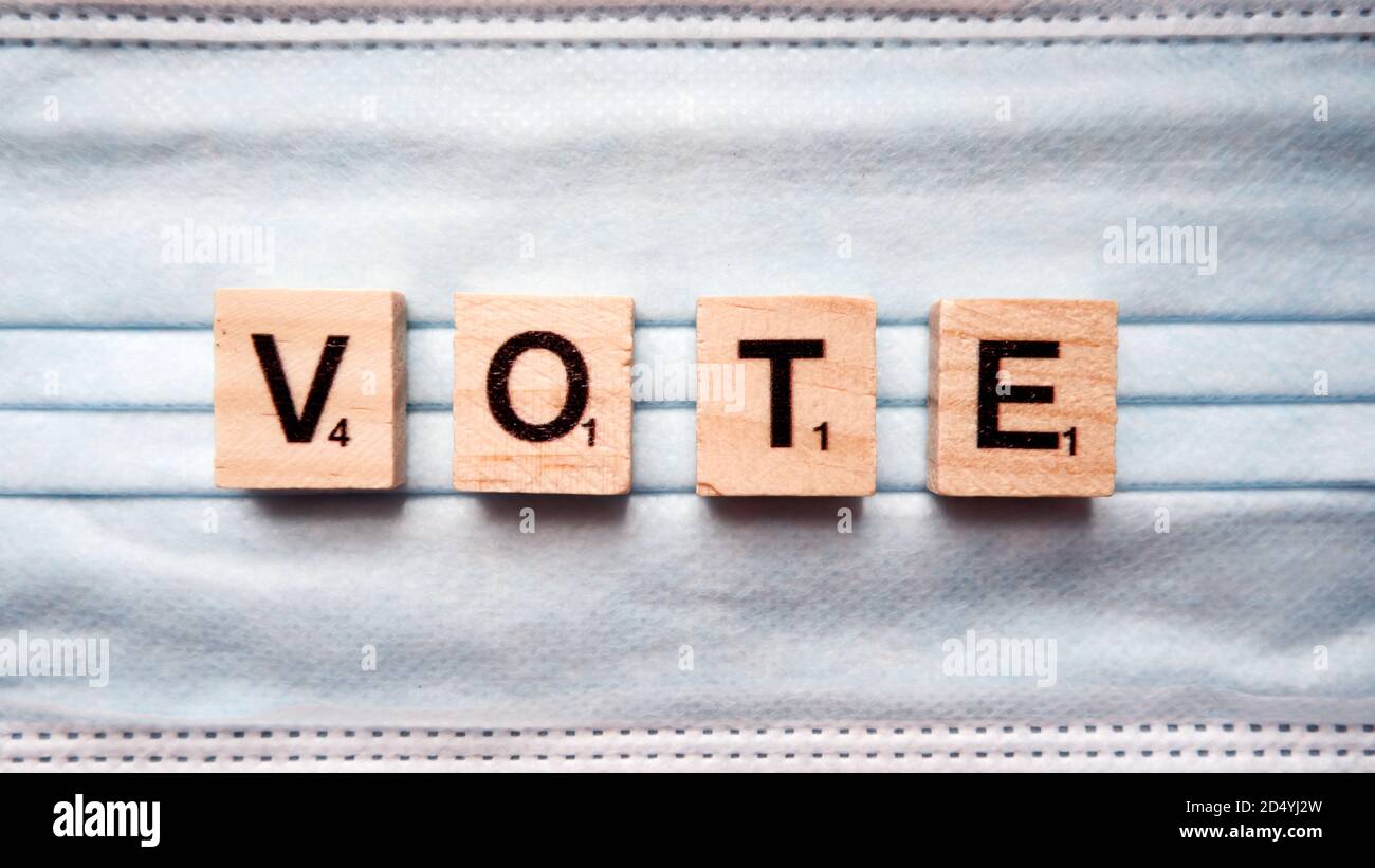 VOTE word text on face mask background Stock Photo - Alamy