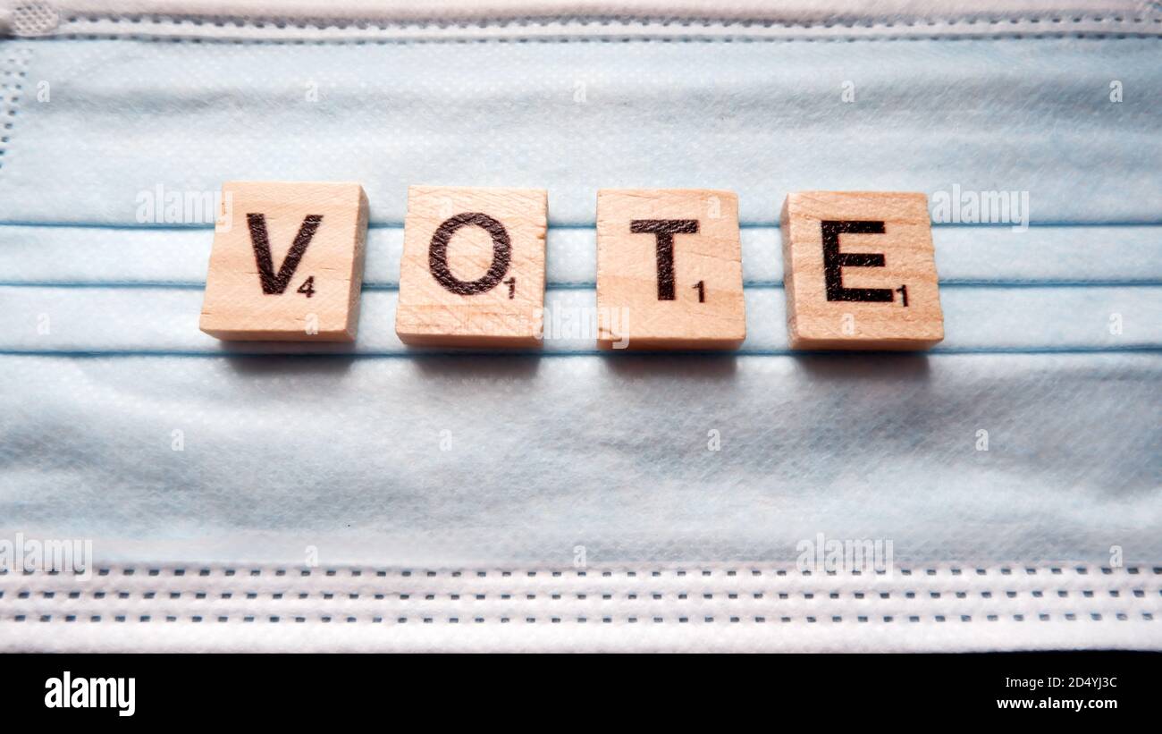 VOTE word text on face mask background Stock Photo - Alamy