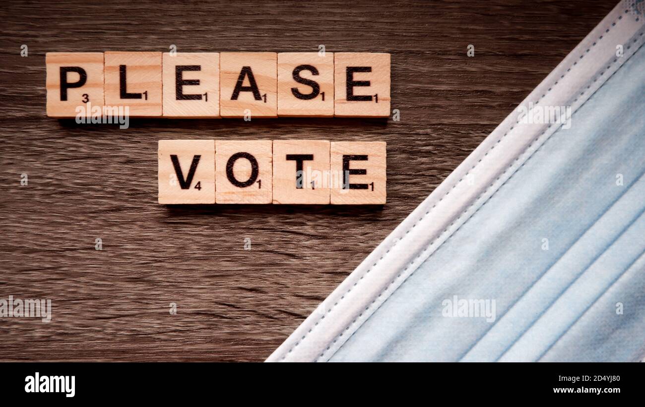 VOTE word text on face mask background Stock Photo - Alamy