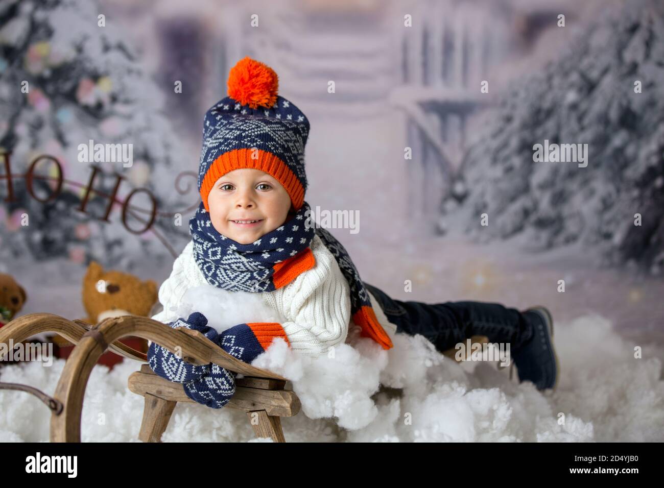 Cute toddler boy with winter outfit, playing in the snow, christmas ...