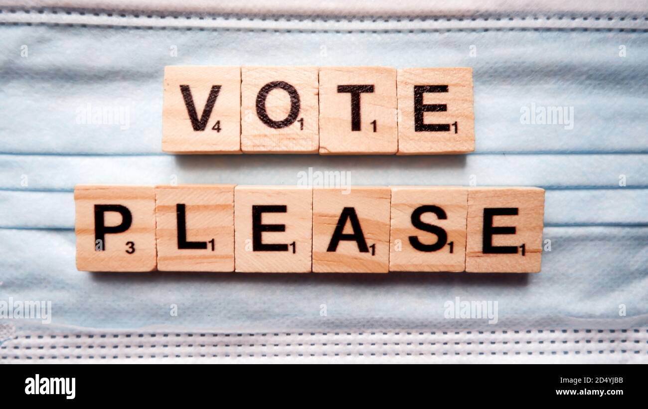 VOTE word text on face mask background Stock Photo - Alamy