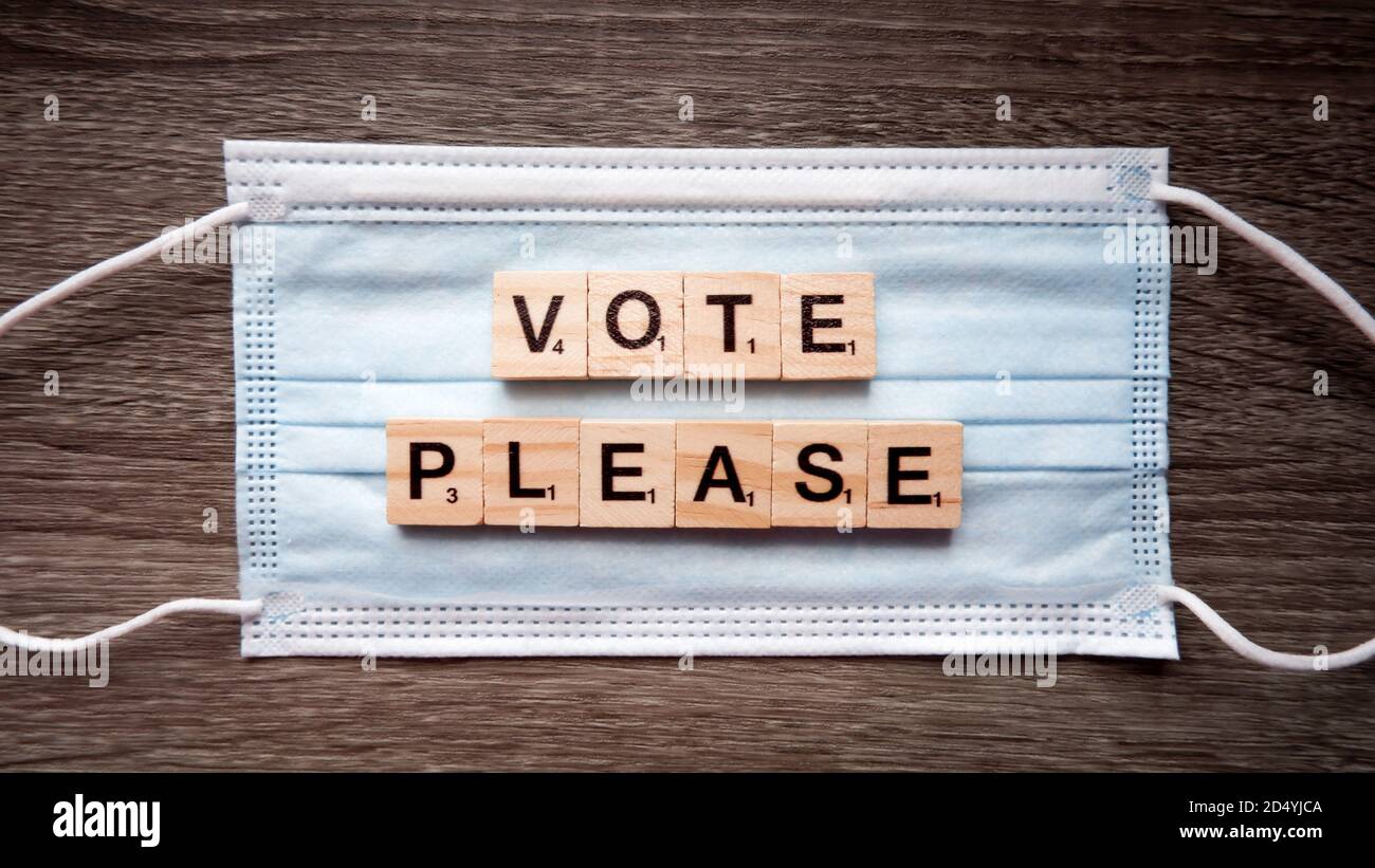 VOTE word text on face mask background Stock Photo - Alamy