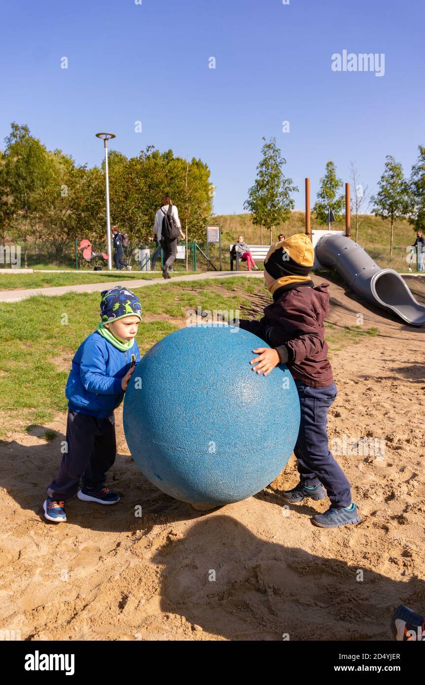 POZNAN, POLAND - Oct 11, 2020: Two young boys playing with a sphere ...