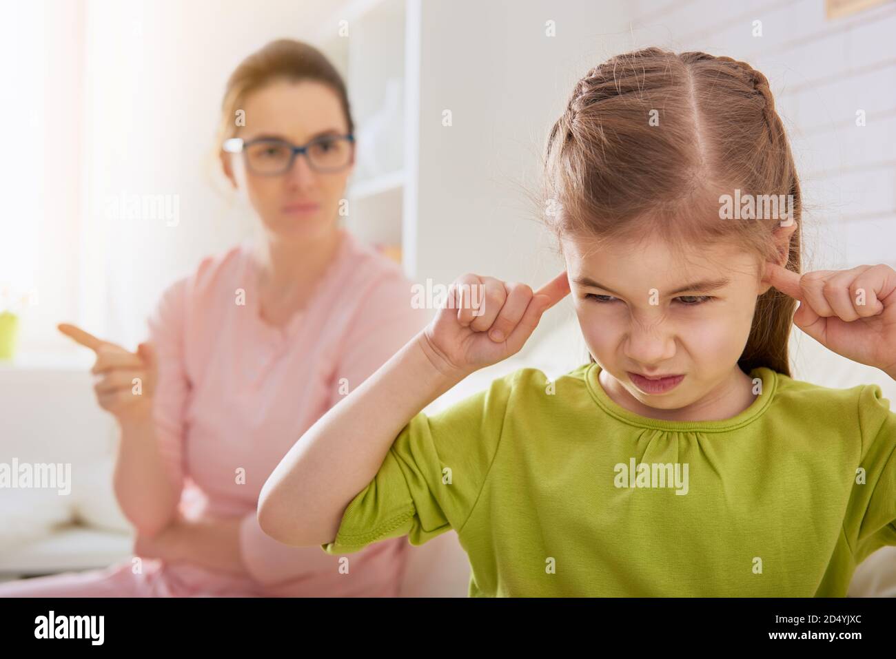 the education of the child. mother scolds her child girl. family ...