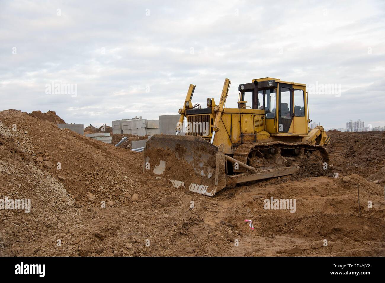 Bulldozer during land clearing and foundation digging at large ...