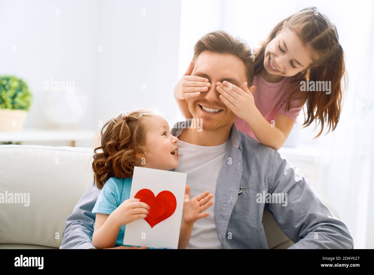 Happy father's day! Children daughters congratulating dad and giving ...