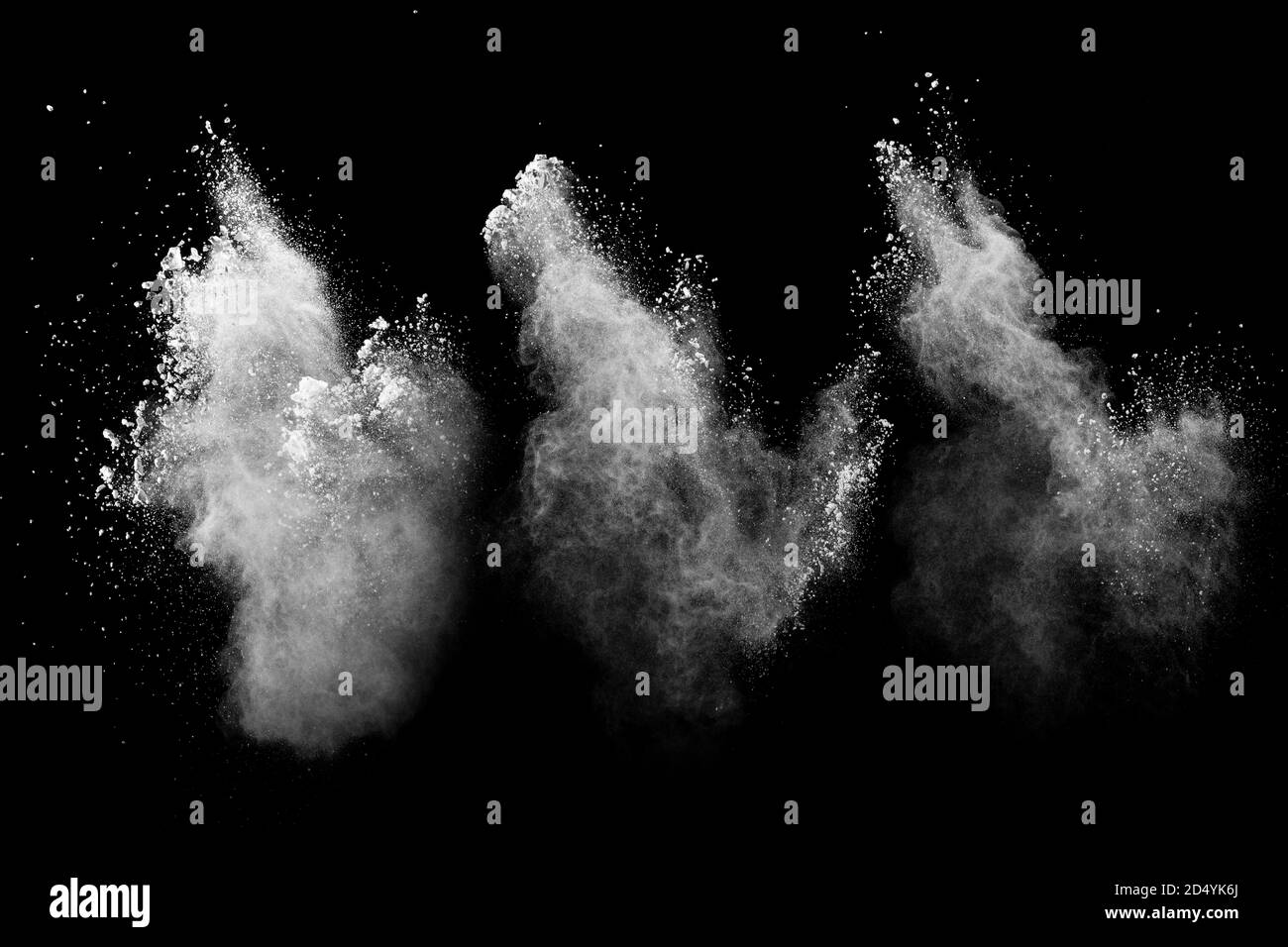 White powder explosion cloud against black background.White dust ...