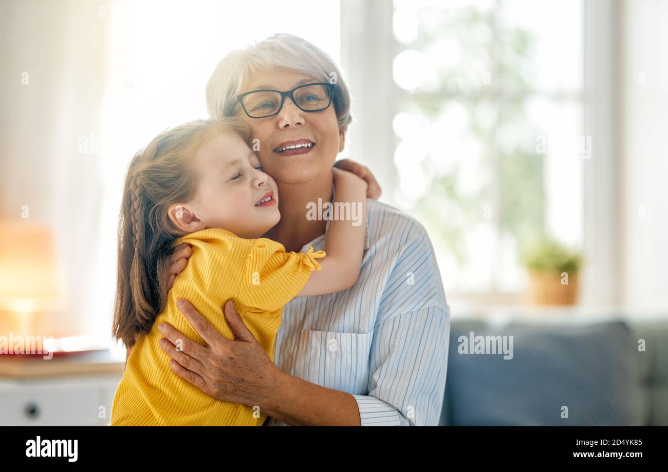 A nice girl and her grandmother enjoying sunny morning. Good time at ...
