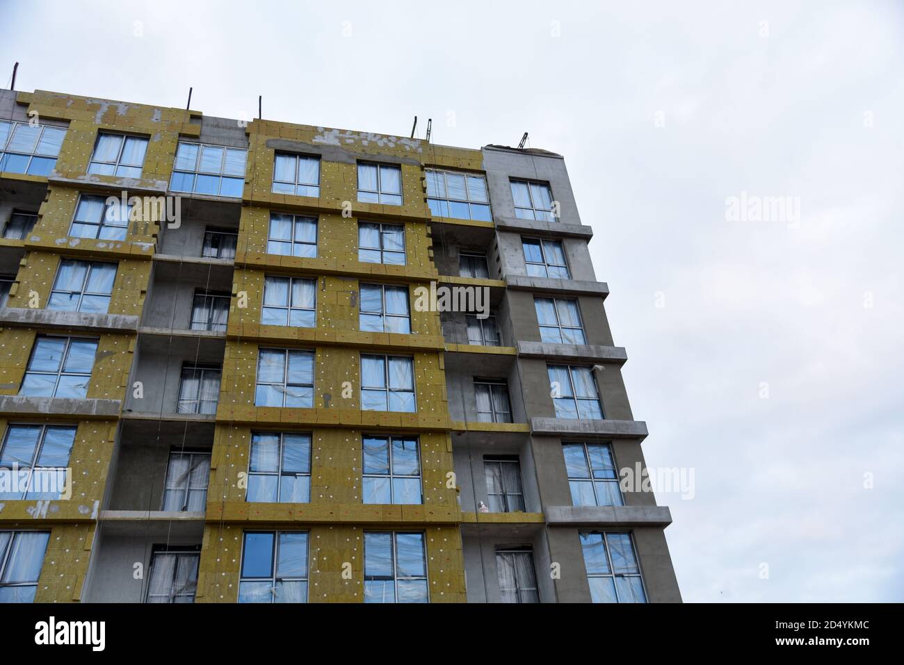 Mineral wool insulation of the facade building on construction site ...