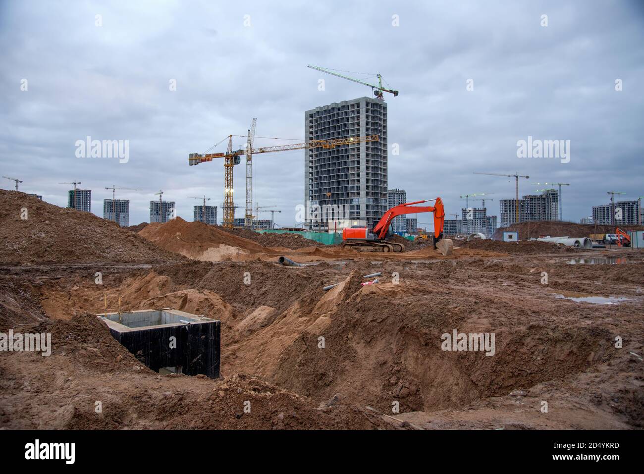 Excavtor and bulldozer digg ground at construction site for the ...