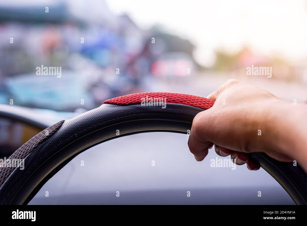 Driving concept, Hand driving a car on the road blurred background ...