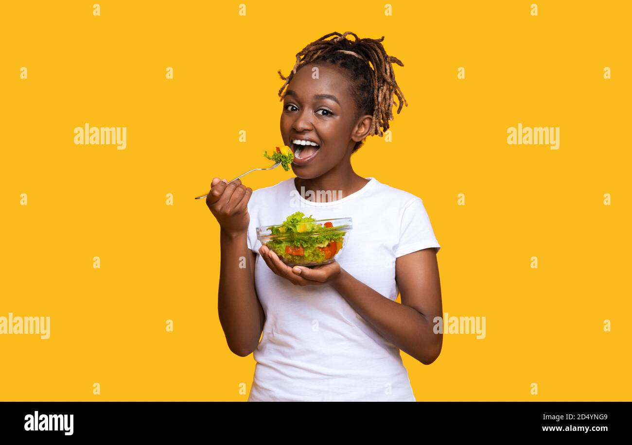 Female eating salad, happy hi-res stock photography and images - Alamy