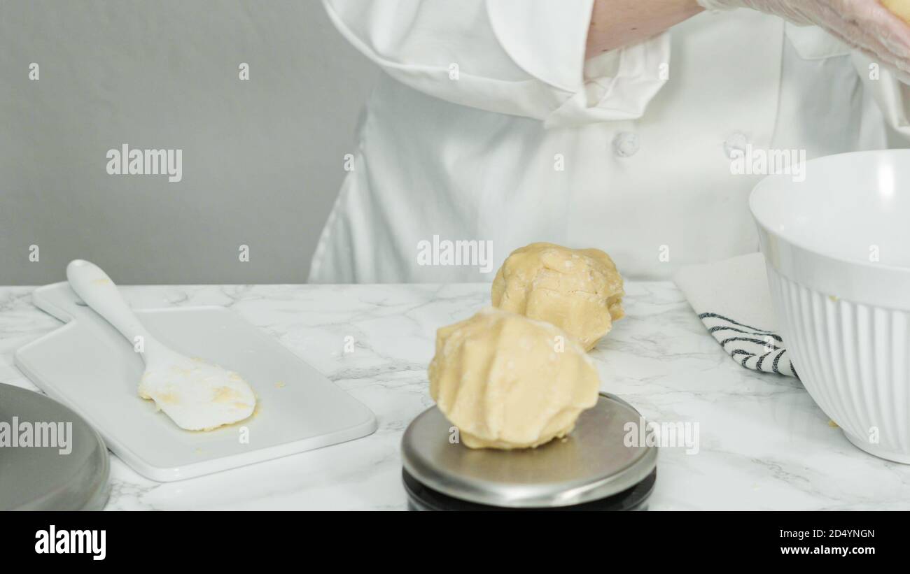 Step by step. Measuring cookie dought with a digital kitchen scale to ...
