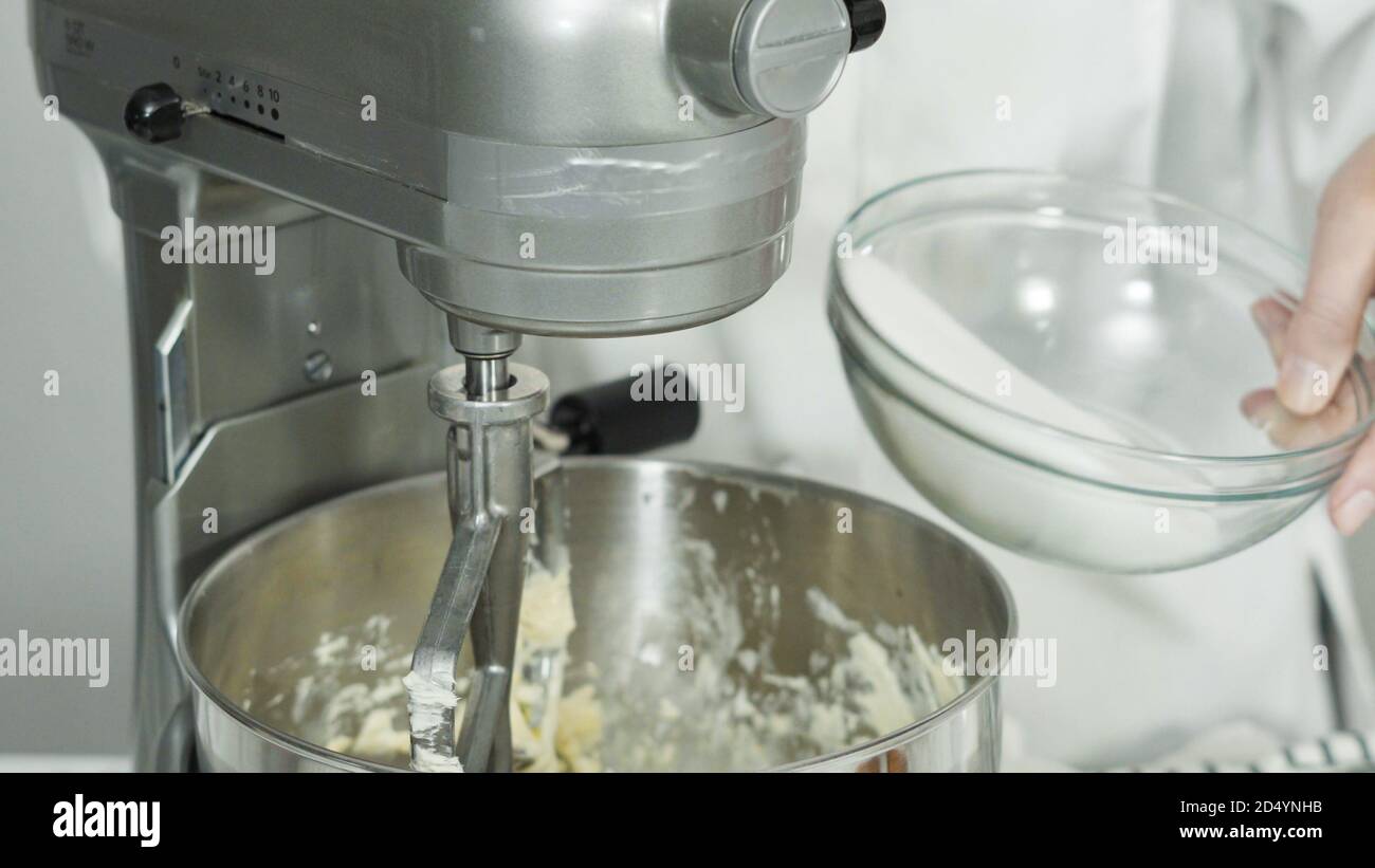 Step by step. Mixing ingredients in standing kitchen mixer to bake ...