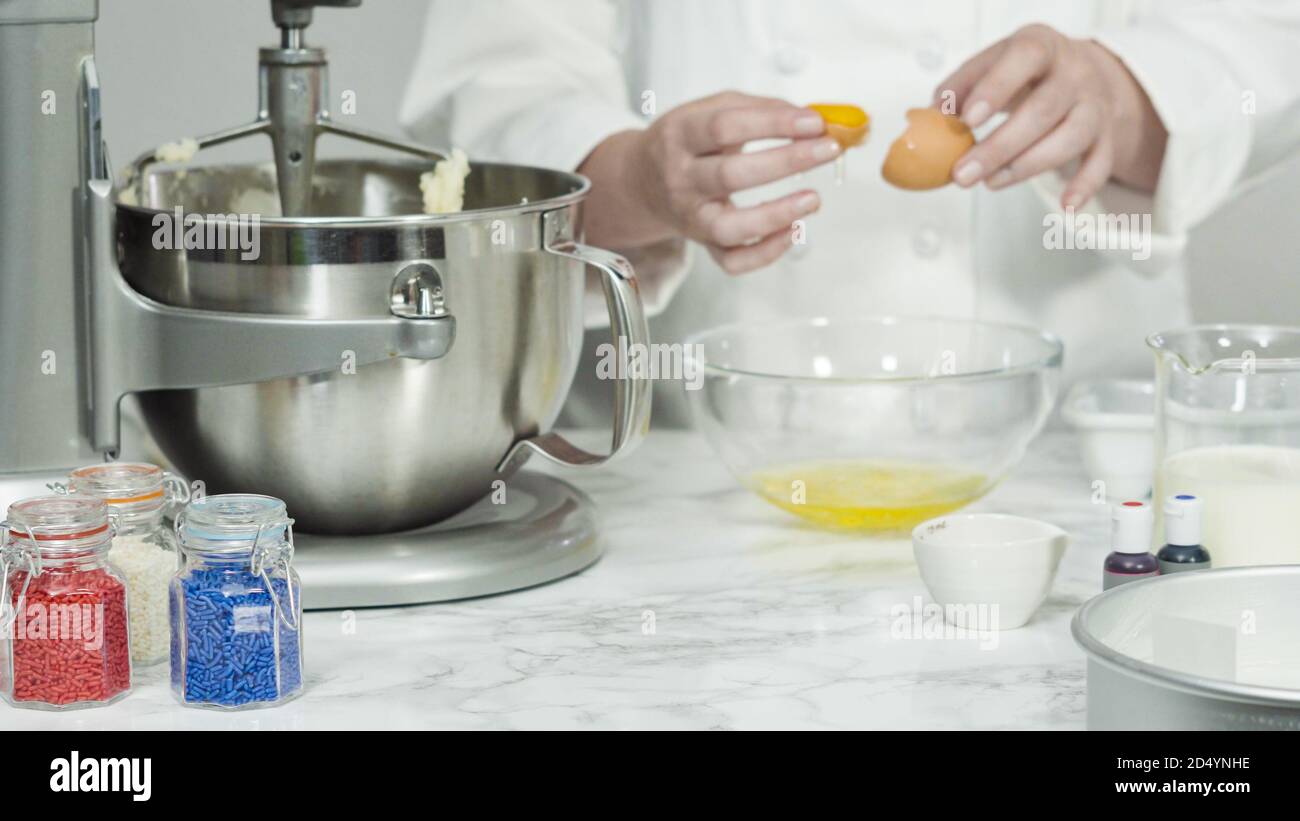 Step by step. Mixing ingredients in standing kitchen mixer to bake a ...