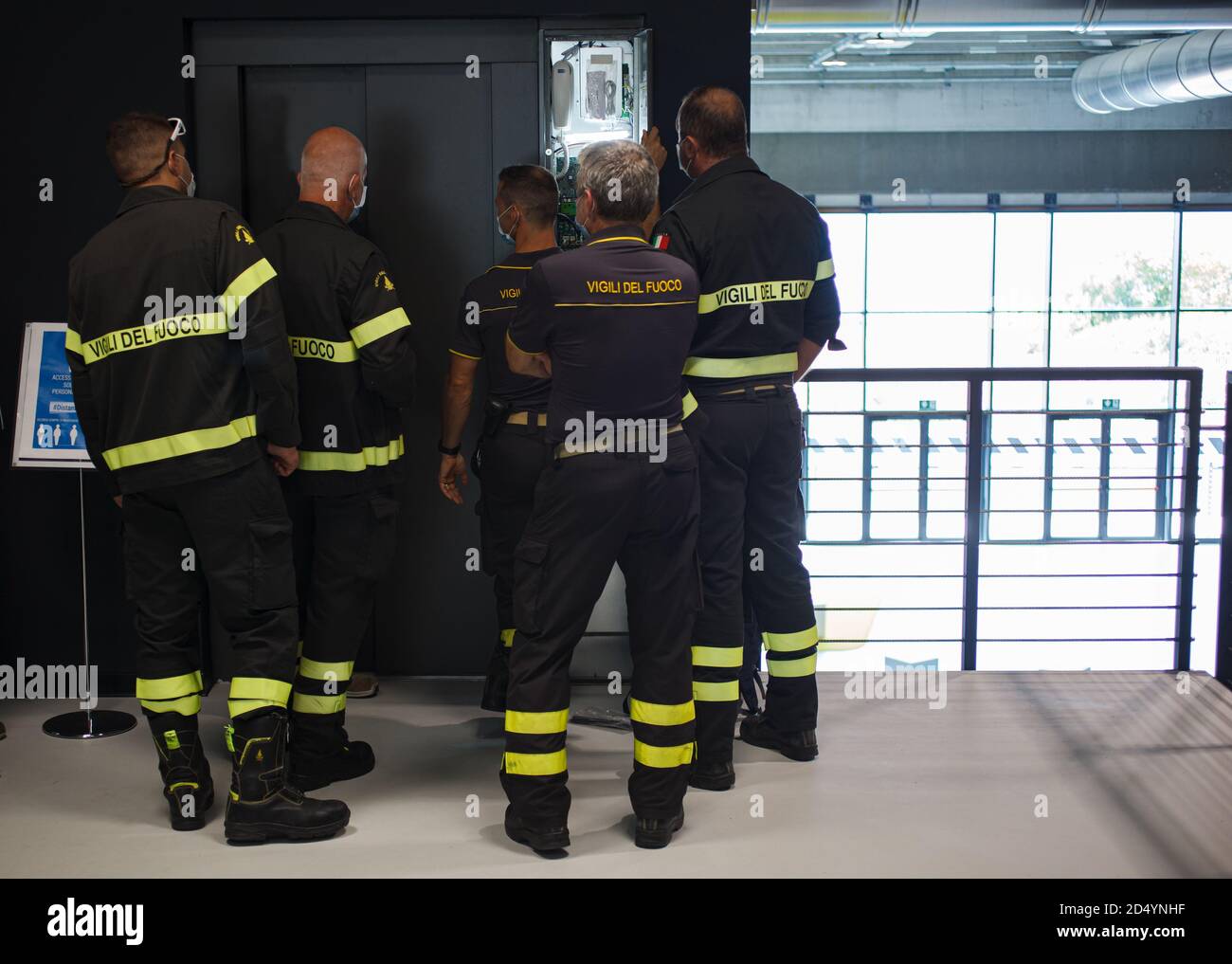 Five Firefighters in uniform checking security system Stock Photo - Alamy