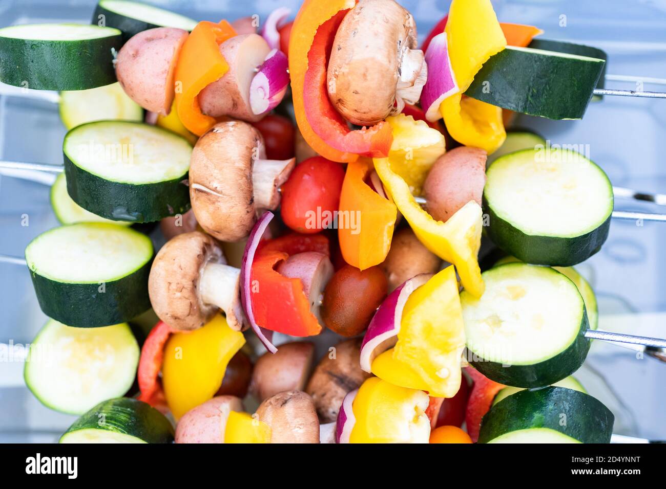 Vegetable skewer ready to be grilled on an outdoor gas grill Stock ...