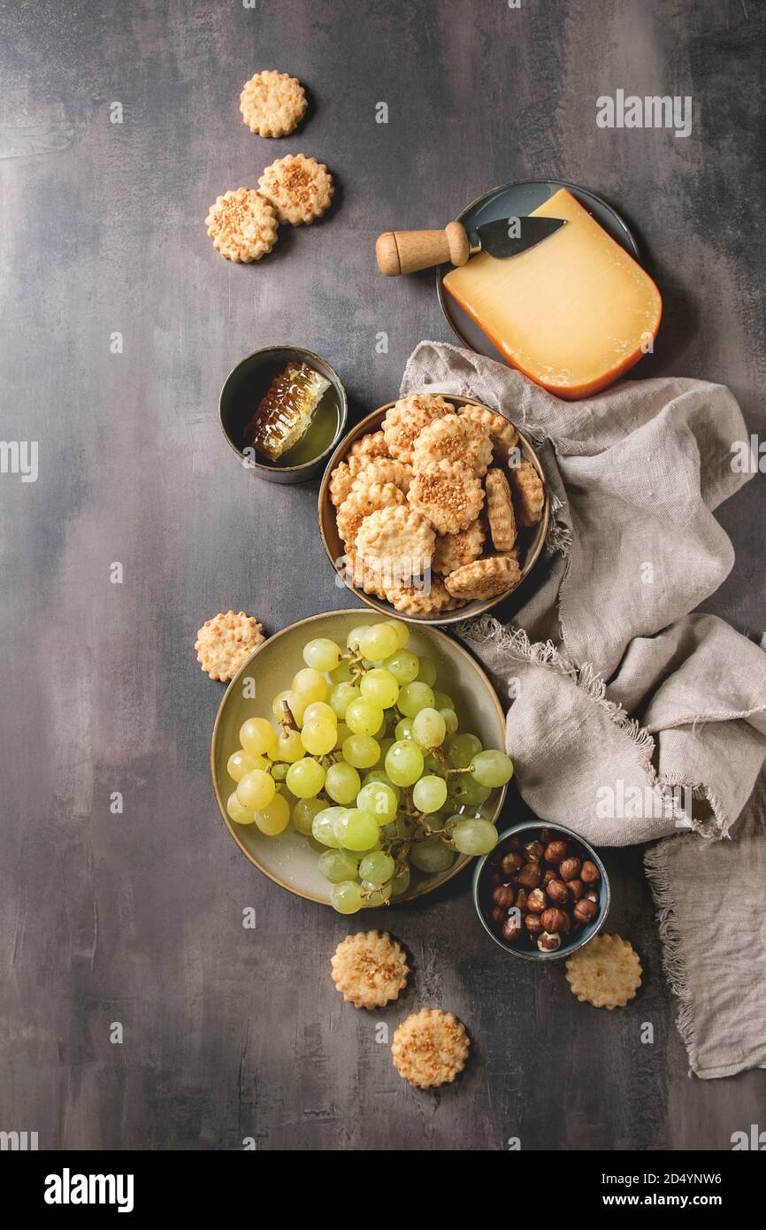 Wine snack. Cheese, grapes, nuts, cheese crackers cookies, honeycombs ...