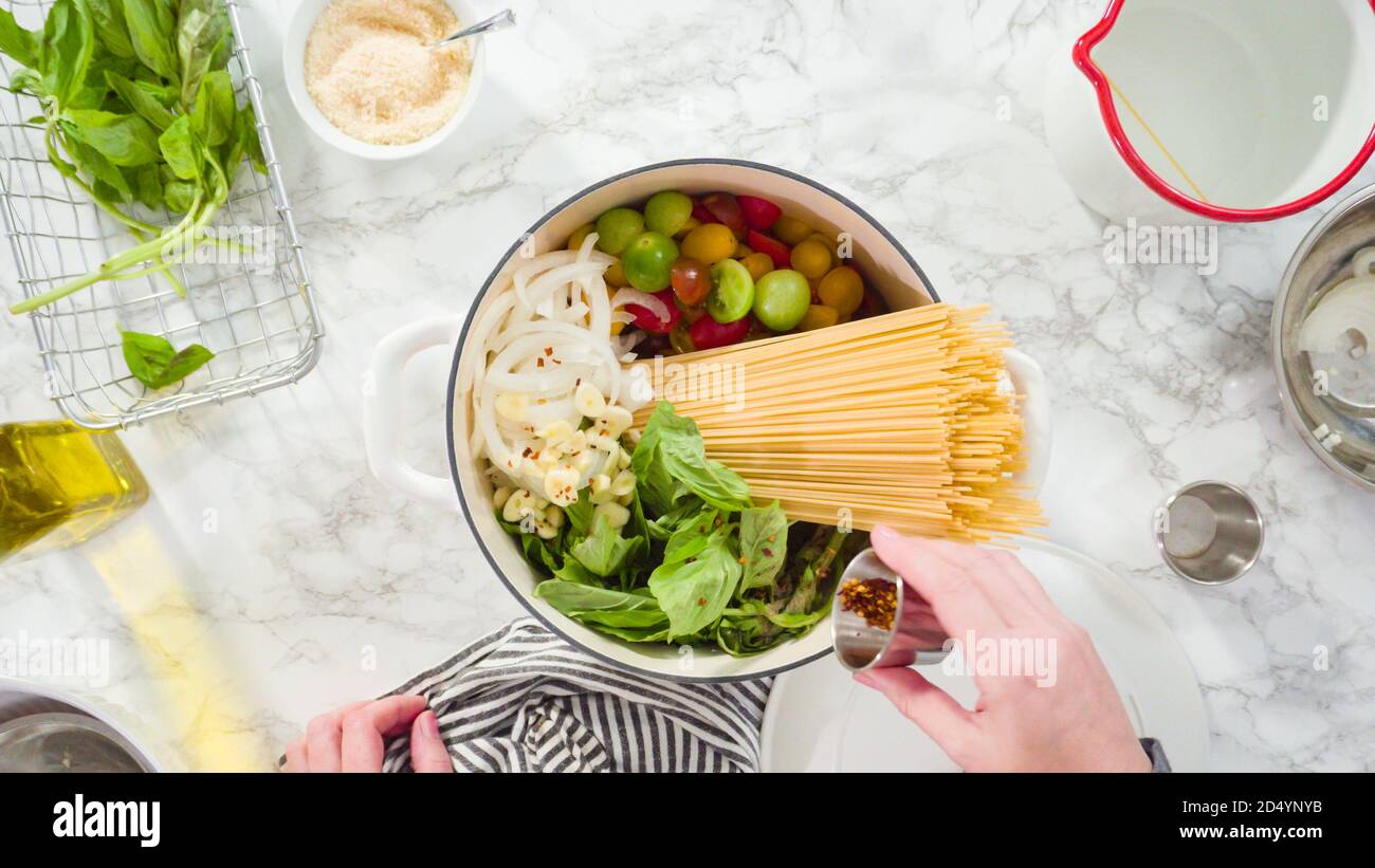 Flat lay. Step by step. Cooking on pot pasta recipe in an enameled cast ...