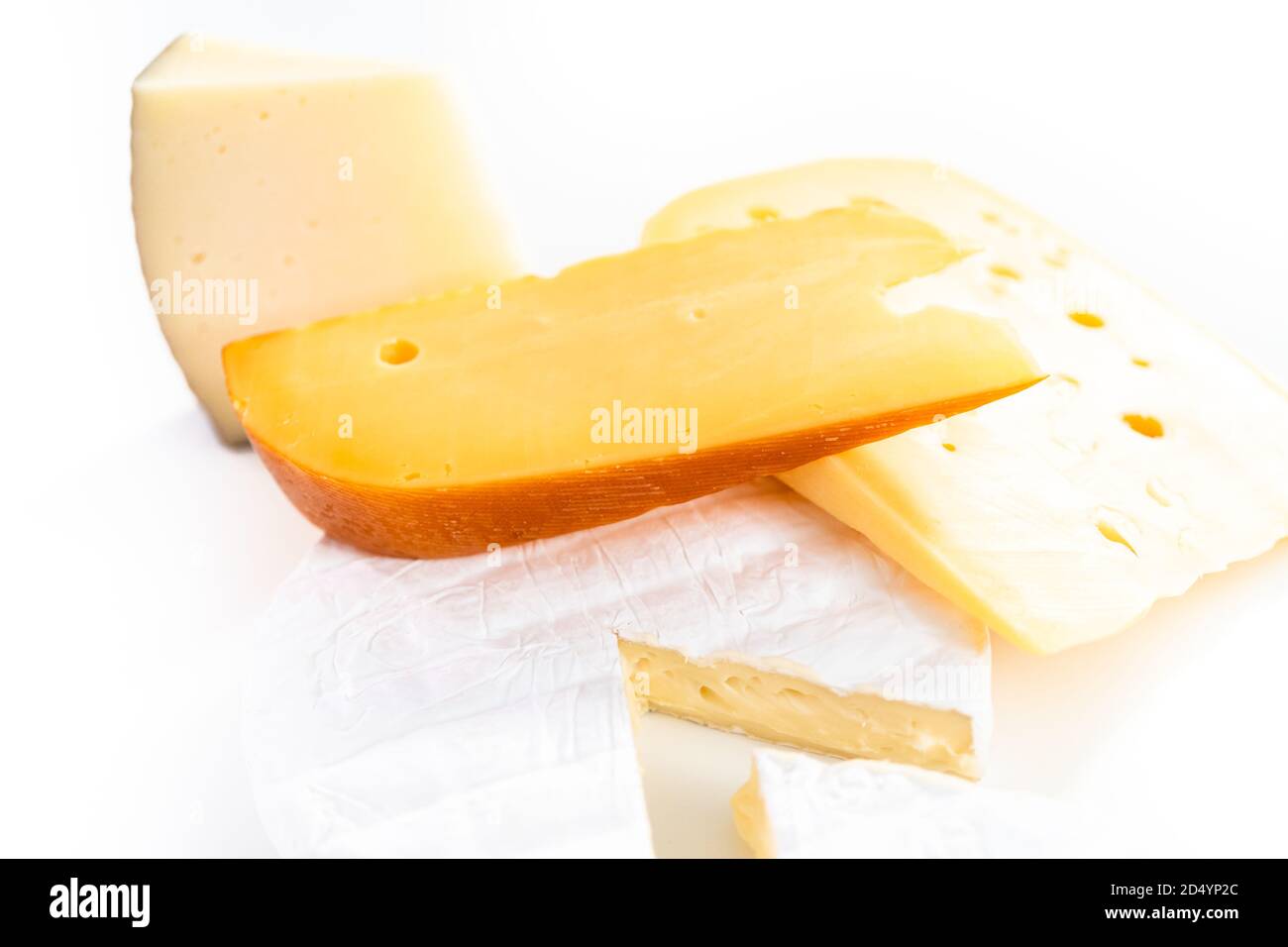 Variety of large wedges gourmet cheese on a white background Stock ...