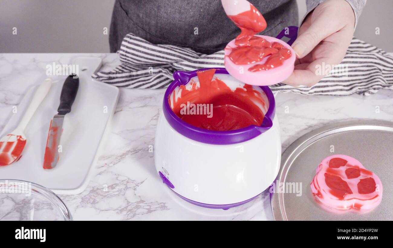 Step by step. Making chocolate hearts and kisses from melted red ...
