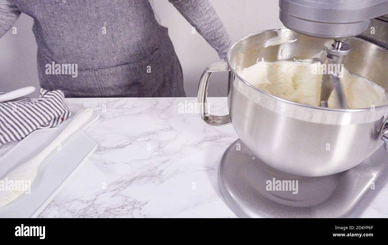 Step by step. Mixing ingredients in a standing kitchen mixer to prepare ...