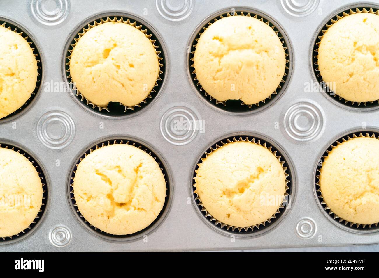 Cooling freshly baked vanilla cupcakes Stock Photo - Alamy