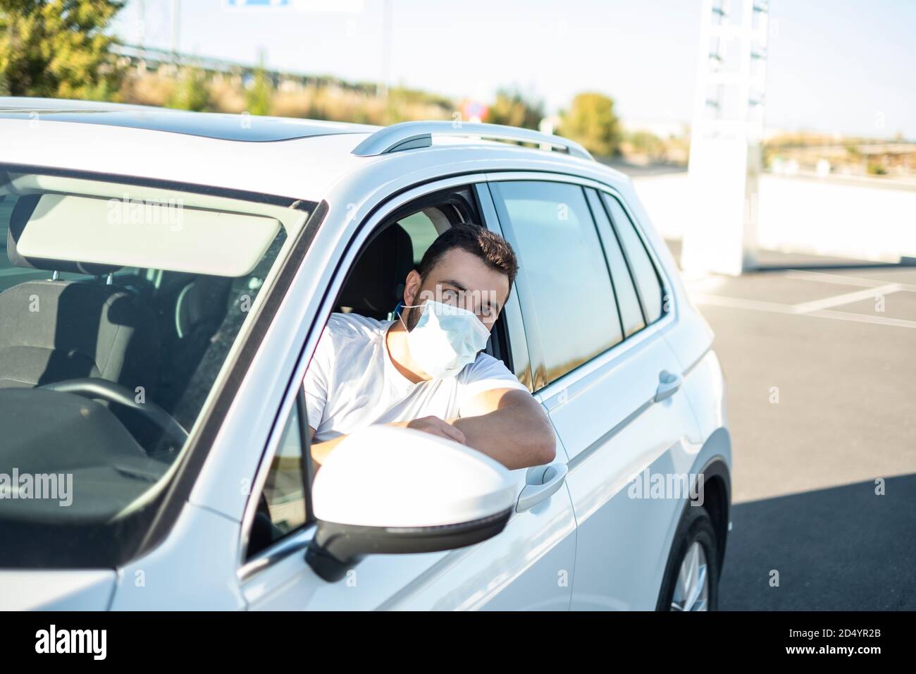 Handsome man looking out the window of the car hi-res stock photography ...