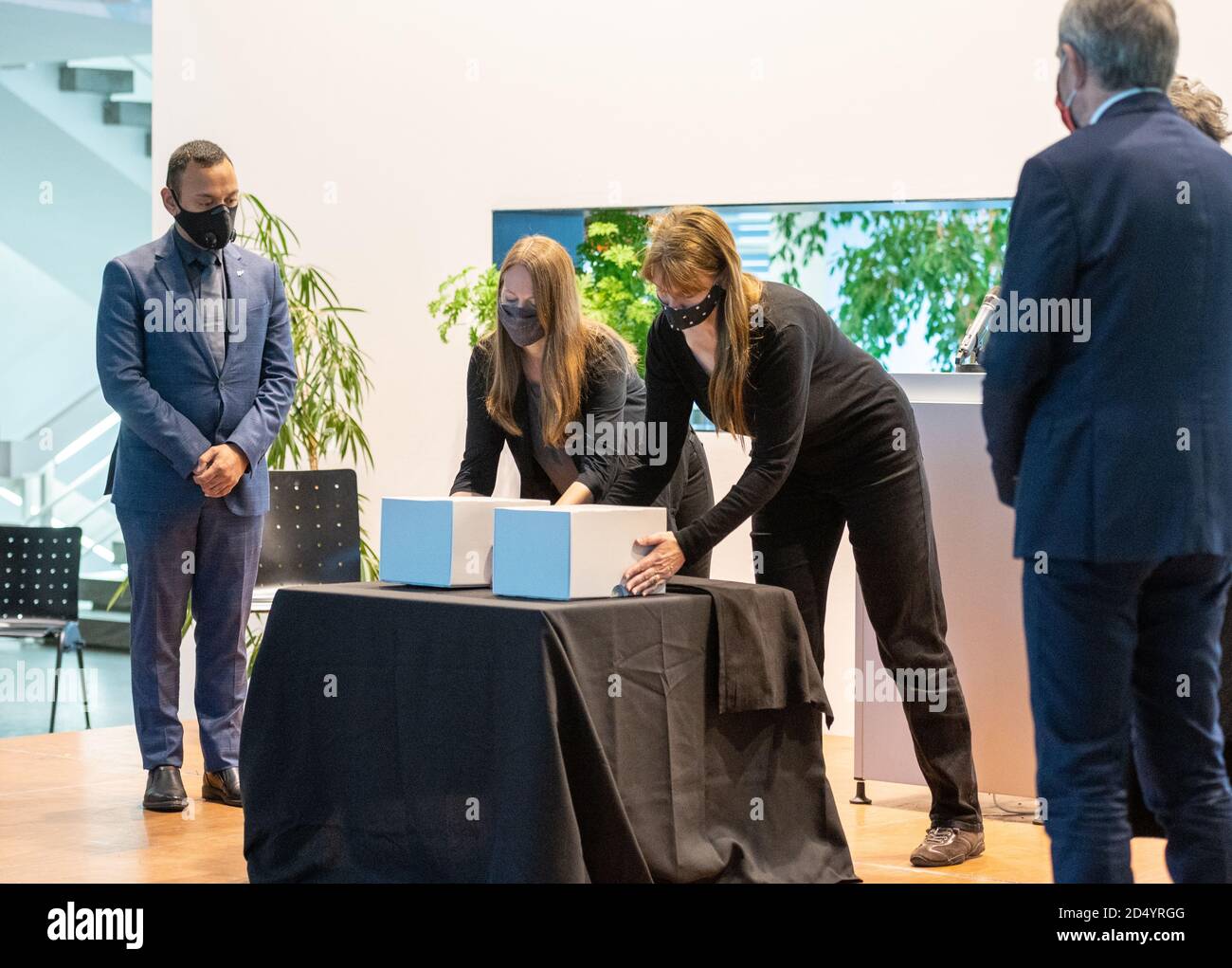 Berlin, Germany. 12th Oct, 2020. Two women put two boxes of Toi Moko ...