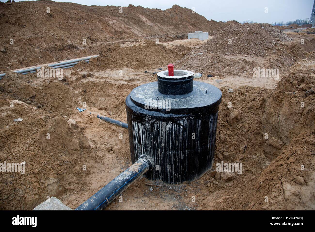 Laying drain pipes and concrete manholes for stormwater system ...