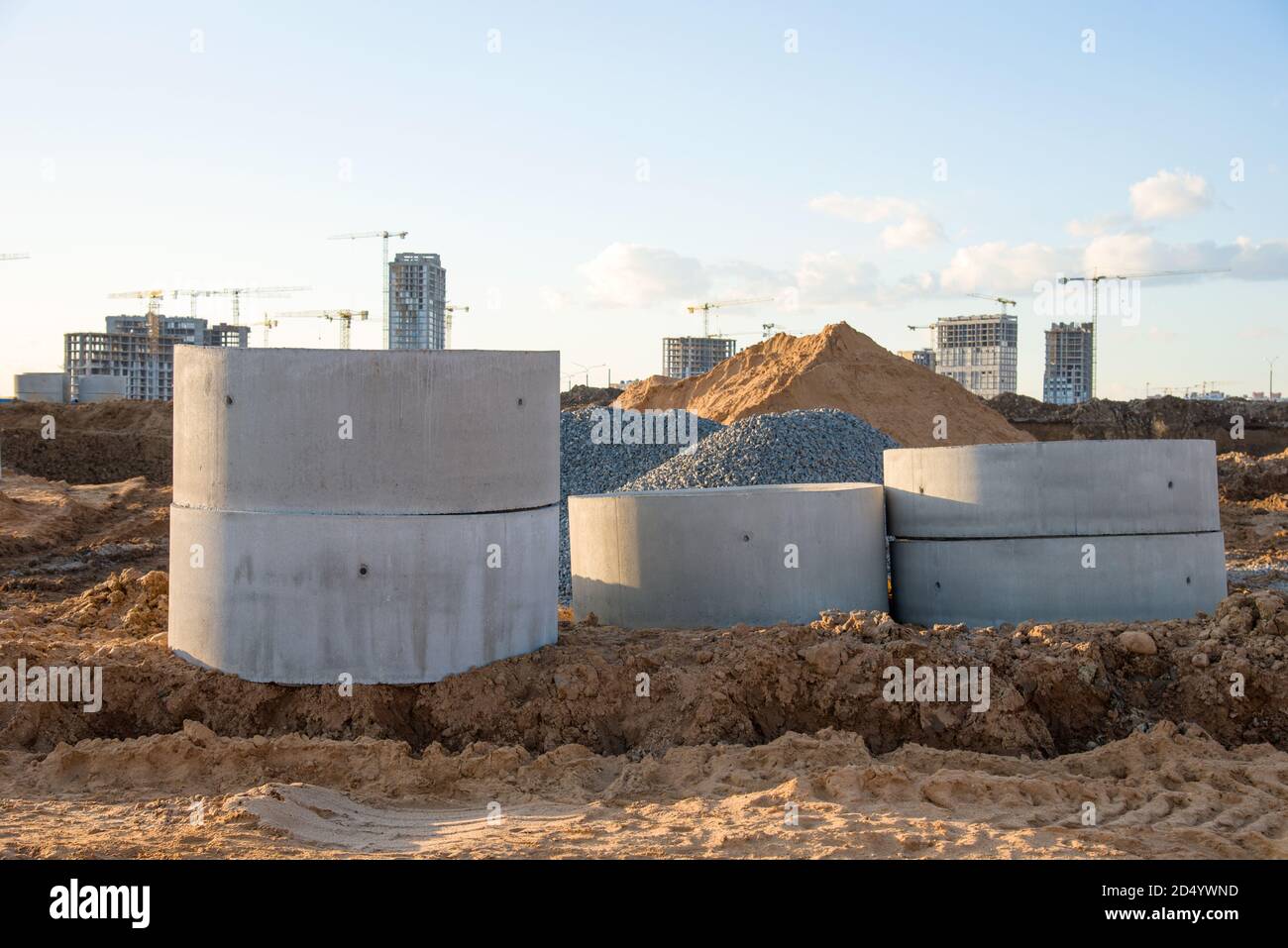 Laying concrete manholes and drain pipes for stormwater system ...