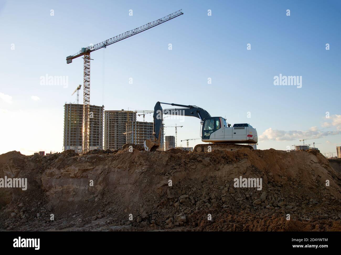 Track-type excavator during earthmoving at construction site. Backhoe ...
