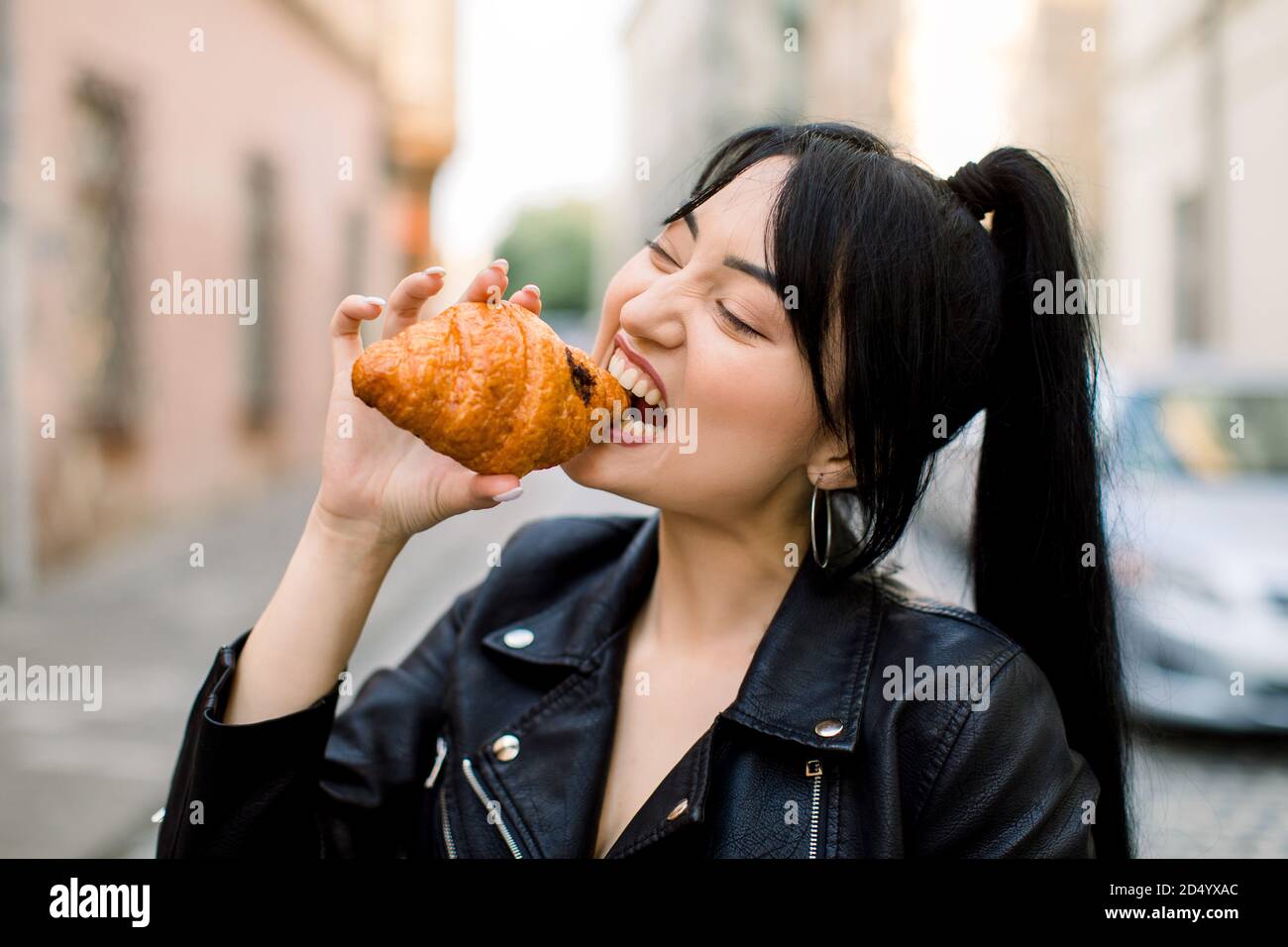 Funny portrait of pretty young Asian very hungry woman, with good ...