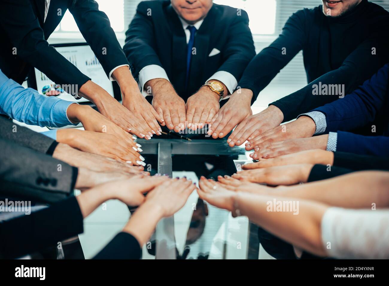 business team joining in a circle their palms Stock Photo - Alamy
