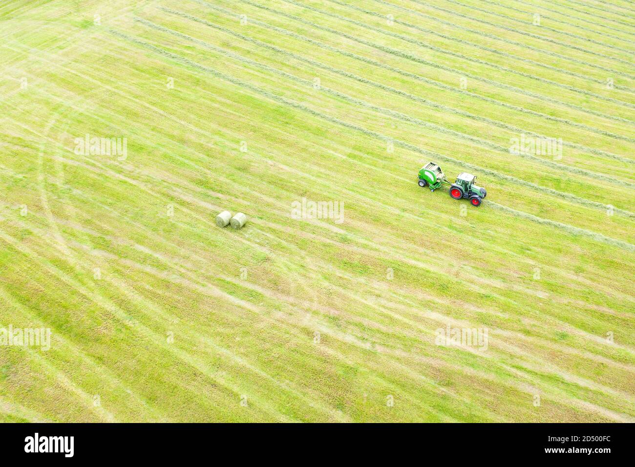 Tractor makes hay from hi-res stock photography and images - Alamy