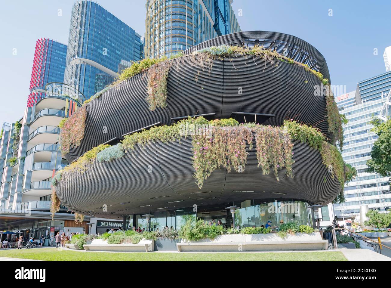 Gardens hang as green curtains over the edges of the three restaurant ...