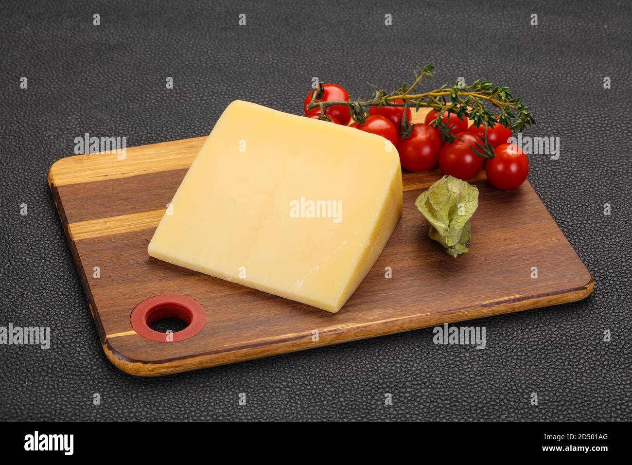 Hard parmesan cheese piece over wooden background Stock Photo - Alamy