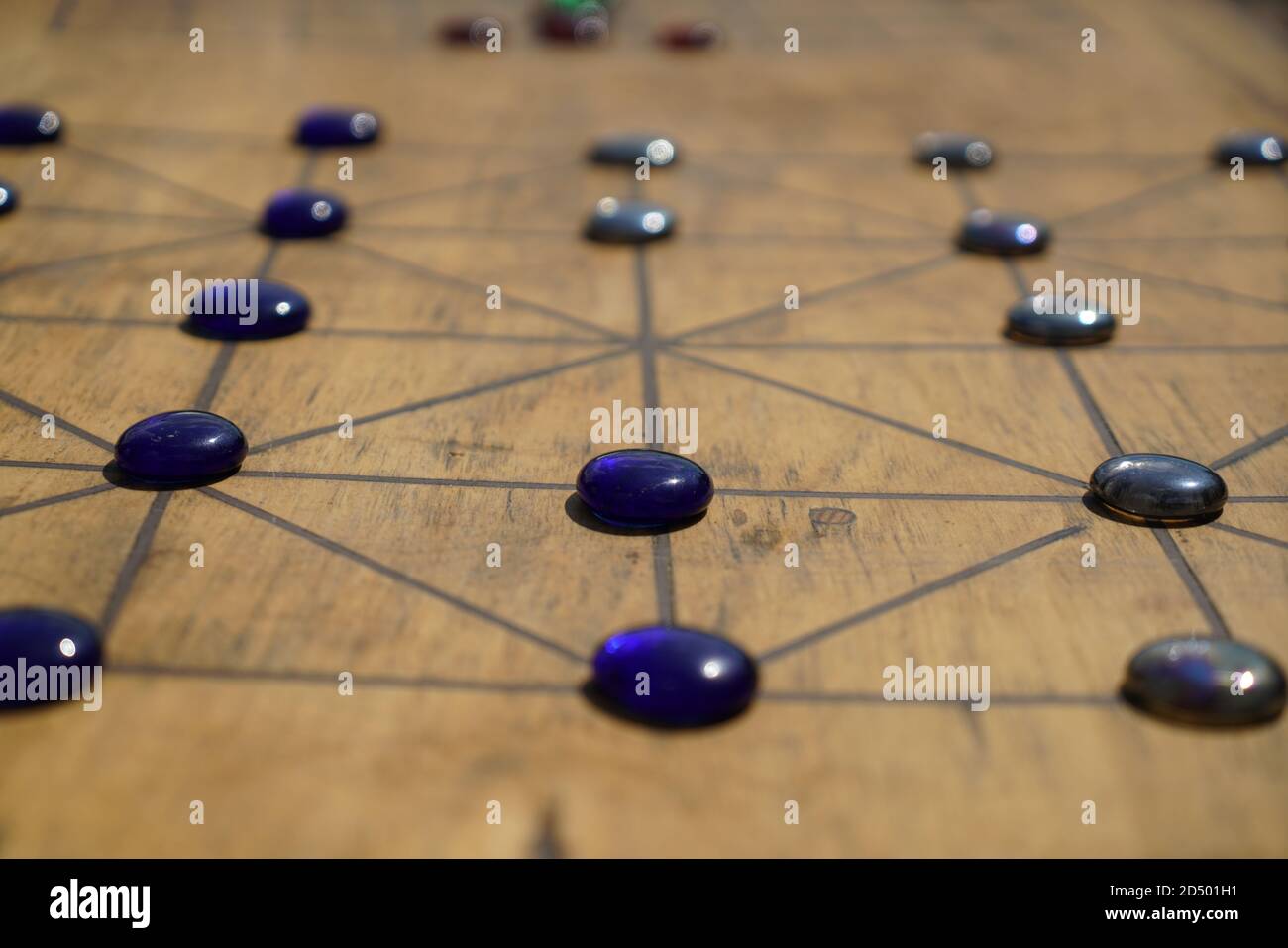 Boardgame with box balls as figures Stock Photo - Alamy