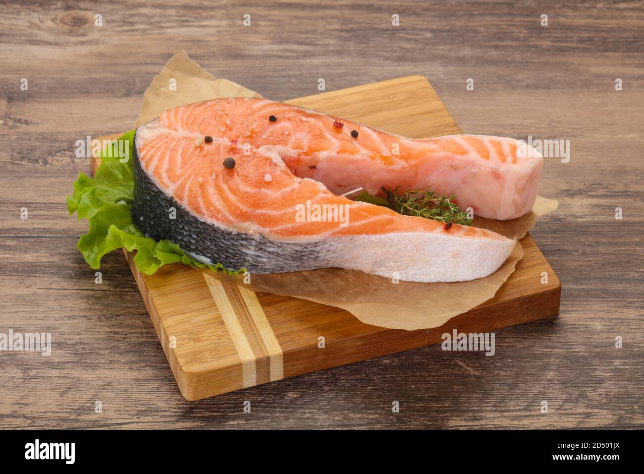 Raw salmon steak with salt and pepper - ready for grill Stock Photo - Alamy