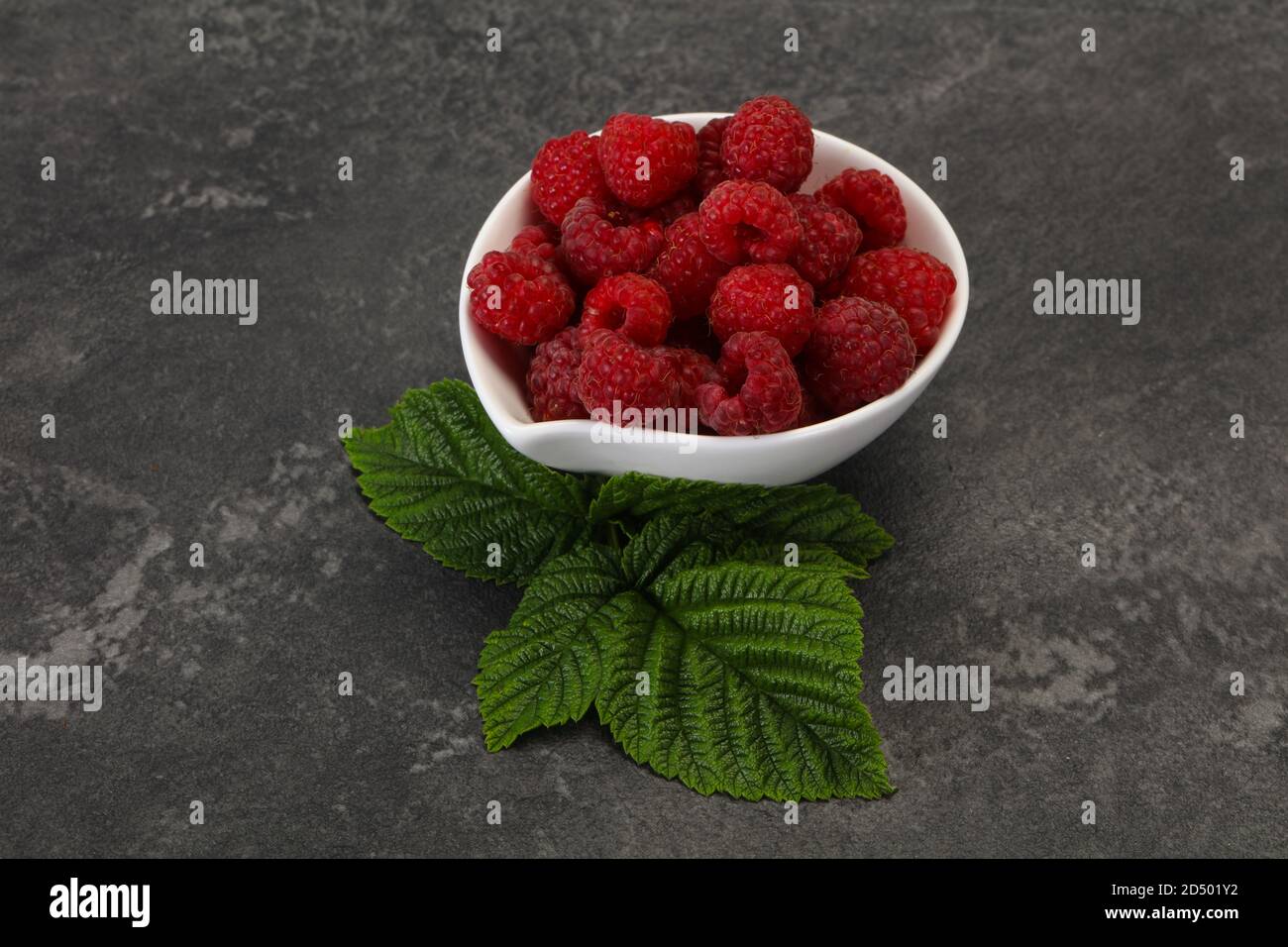 Red bright ripe sweet raspberry with leaf Stock Photo - Alamy