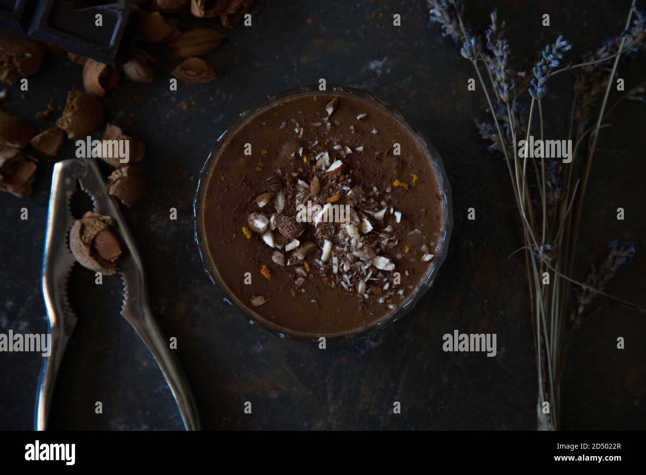 High angle shot of a delicious chocolate mousse with nuts on the table ...