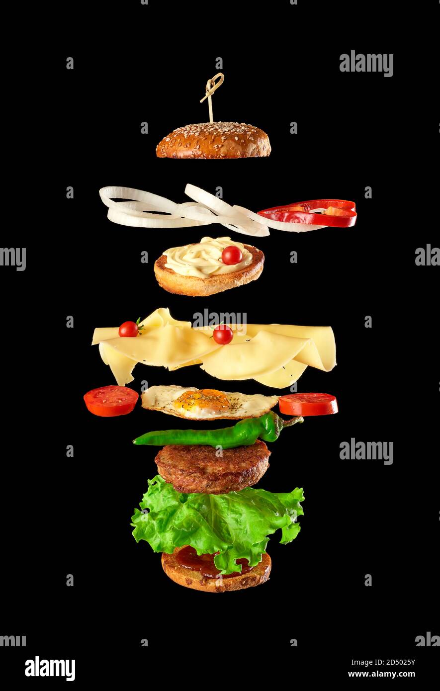 big tasty burger with meat cutlet, cheese, fried egg, tomatoes ...