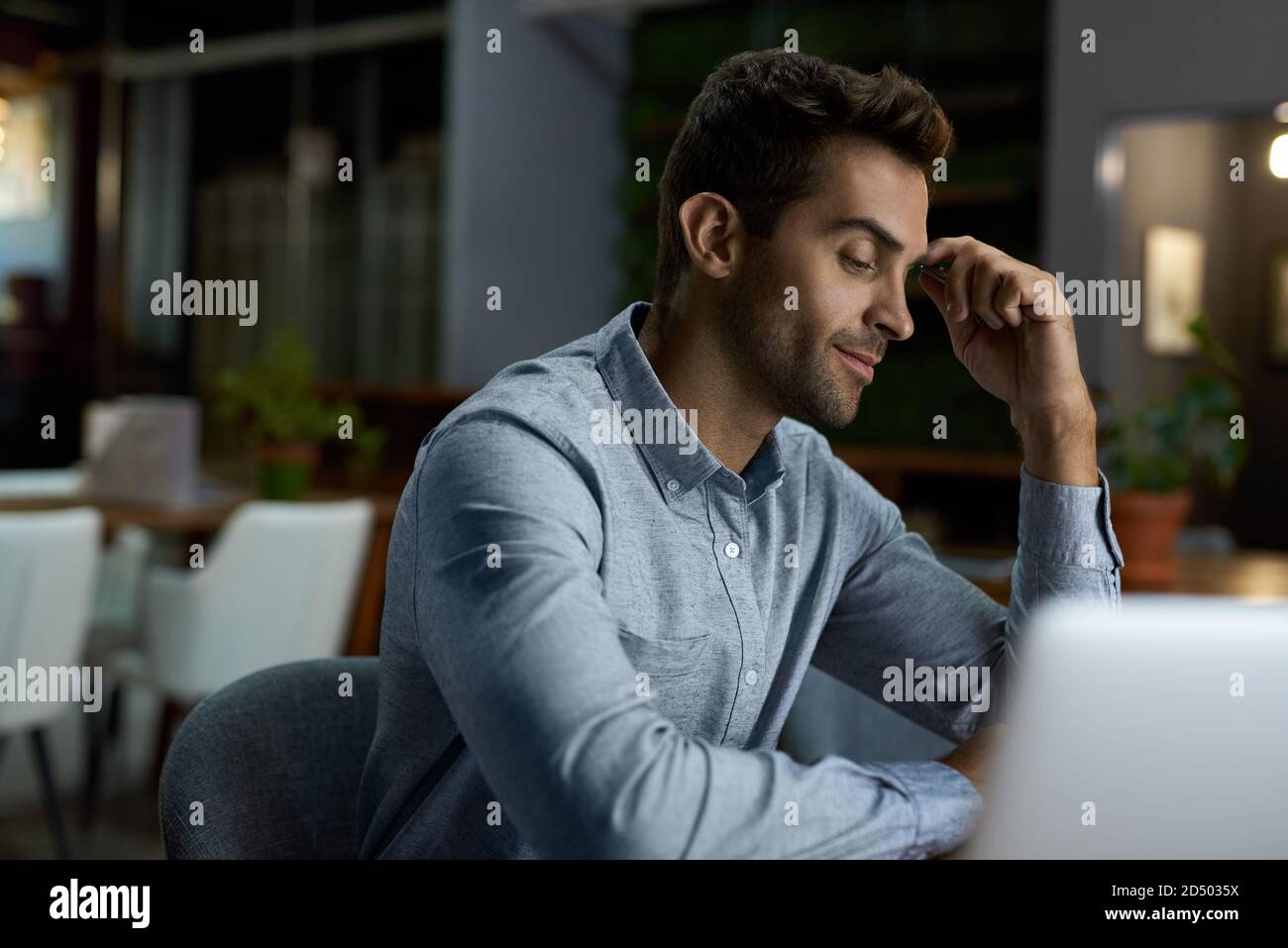 Young businessman working at his desk in a quiet office Stock Photo - Alamy